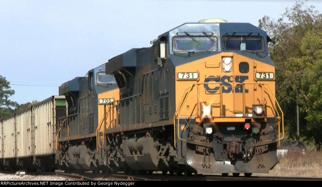 CSX 731 & 705 / ES44AC pulling a loaded coal train on an incline